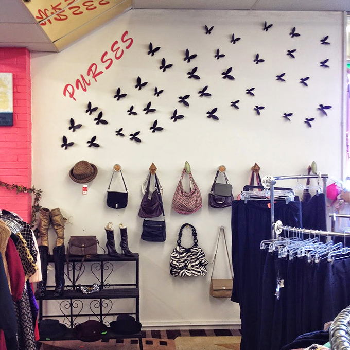 The "Purses" wall features a butterfly migration of handbags&mdash;fashion that quite literally takes flight in this creative display.