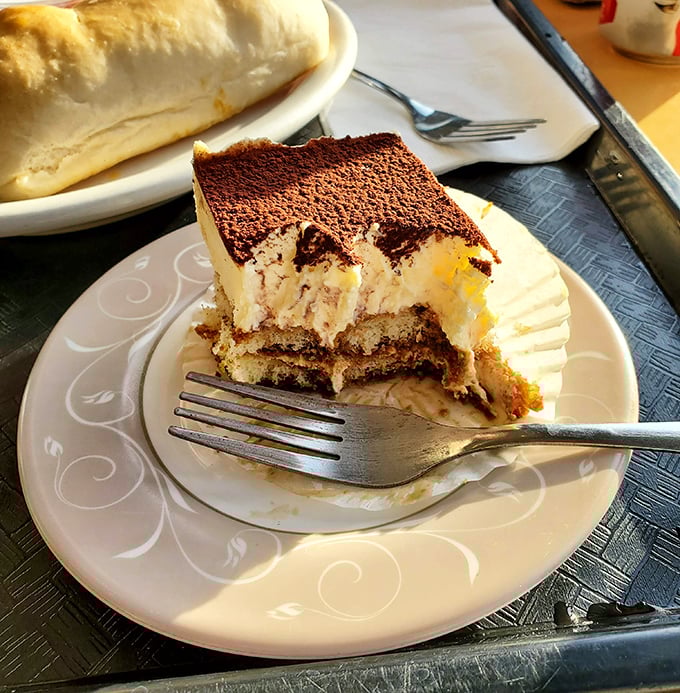 This tiramisu doesn't just satisfy a sweet tooth; it creates a religious experience. Layers of coffee-soaked ladyfingers and mascarpone that would make nonna weep.