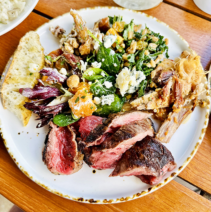 The tomahawk steak arrives like a prehistoric masterpiece, ready to transport you to carnivorous paradise.