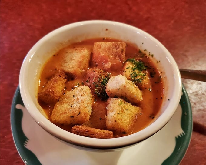 Tomato soup elevated from childhood memory to grown-up comfort. Those homemade croutons aren't just floating&mdash;they're doing the backstroke in tomato glory.
