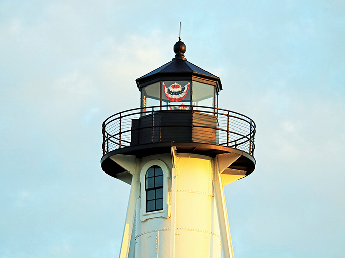 The lantern room crowns the lighthouse like a maritime tiara, complete with patriotic bunting &ndash; America's coastal royalty.