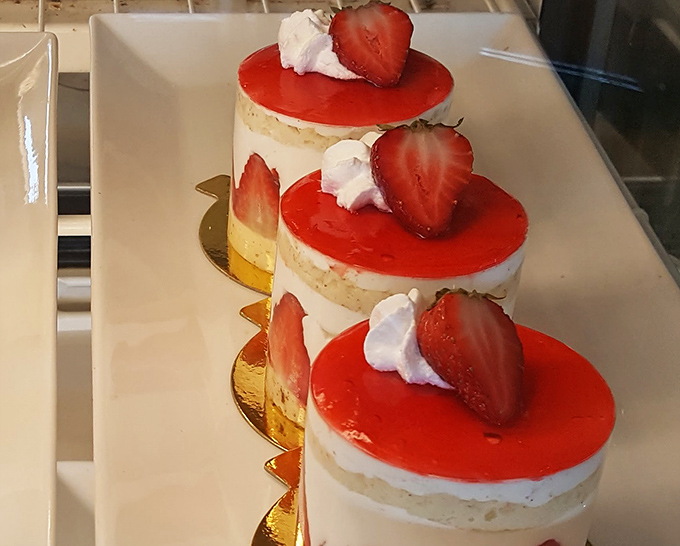 Strawberry-topped tres leches cakes that look like they're auditioning for a dessert calendar. Each layer promises a different dimension of sweet indulgence.