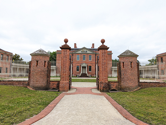 Tryon Palace stands as North Carolina's first permanent capitol, its brick entrance columns guarding centuries of history. Colonial architecture that puts your home renovation ambitions in perspective.