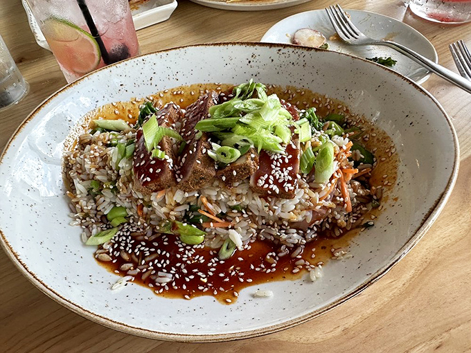 A tuna bowl that's basically a vacation in dishware form &ndash; sesame-crusted protein nestled on rice with a sauce worth bottling.