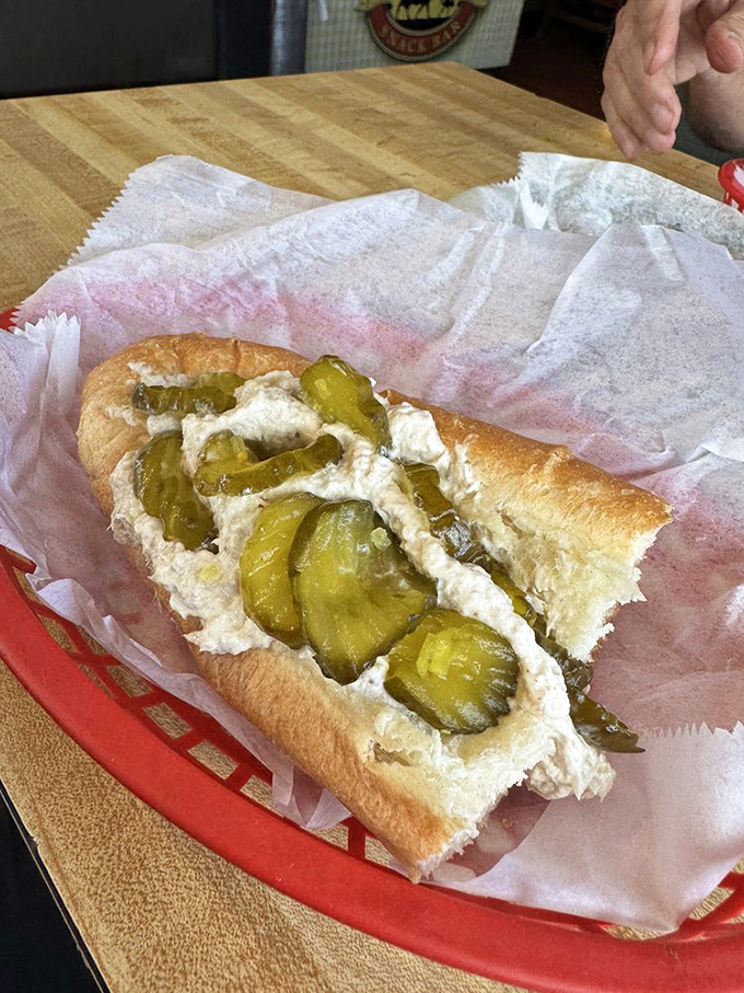 This tuna sub with pickles isn't just lunch; it's an edible masterpiece that would make Neptune himself swim upstream for a bite.