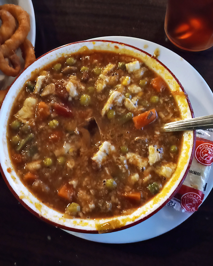 Soup that could end family feuds. Each spoonful of this hearty vegetable medley carries the kind of honest flavor that chain restaurants try desperately to replicate.