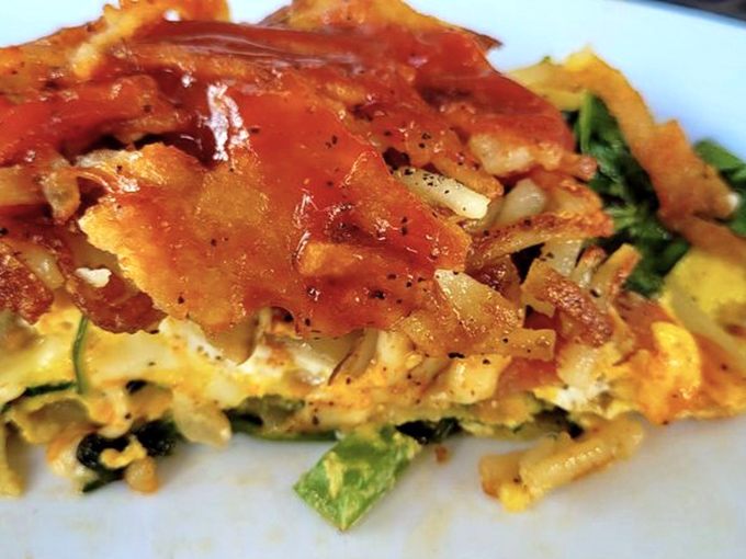This isn't just an omelet &ndash; it's a vegetable garden wrapped in fluffy eggs, topped with a sauce that could make cardboard taste delicious.