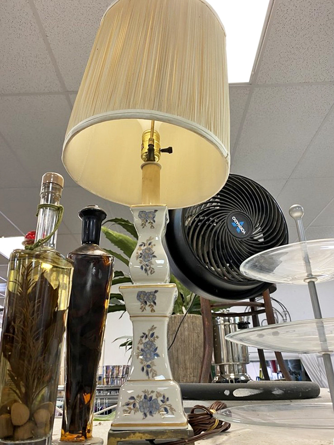 Decorative bottles and a vintage lamp that could tell stories of dinner parties past. Mid-century chic without mid-century prices.