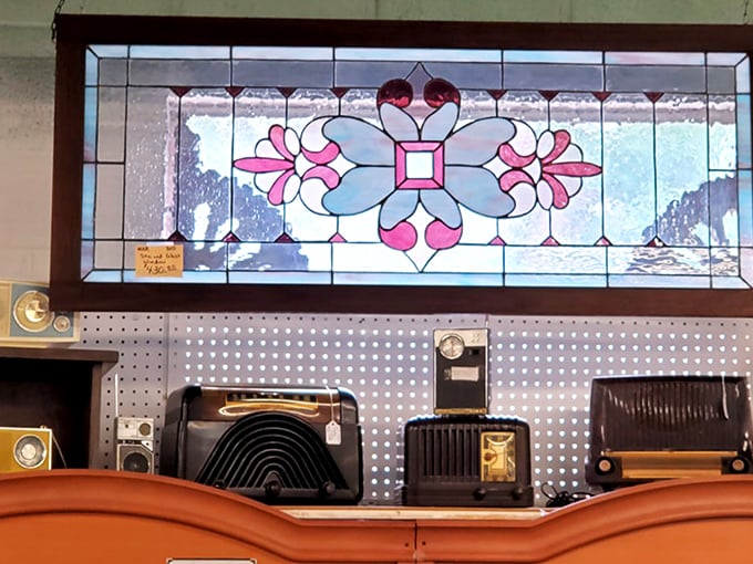 Beneath that stunning stained glass, a lineup of vintage radios stands ready to broadcast big band tunes and FDR's fireside chats.