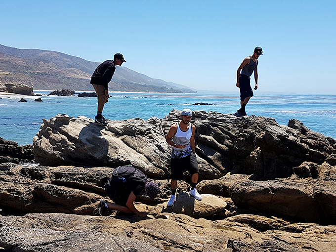 Rock hopping requires the balance of a gymnast and the optimism of a lottery ticket buyer. These adventurers navigate Leo Carrillo's natural playground with varying degrees of confidence.