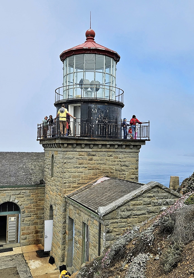 Visitors explore the lighthouse tower, where the panoramic views make even your best vacation photos look like they need a serious upgrade.