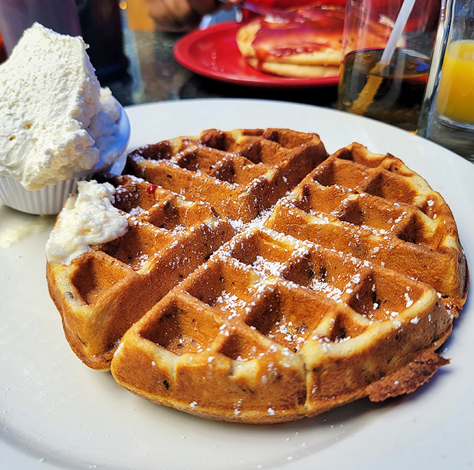 This waffle arrives looking like edible architecture &ndash; those perfect squares just begging for syrup to fill them up.