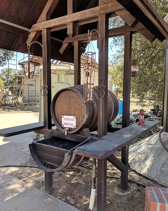 Medieval wine service with California flair! This wooden barrel setup proves that refreshments in the Middle Ages weren't all about mead and gruel.