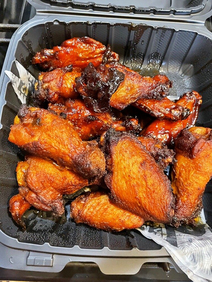 These wings aren't just cooked &ndash; they're transformed into crispy, sauce-lacquered morsels that make you forget you're an adult with table manners.