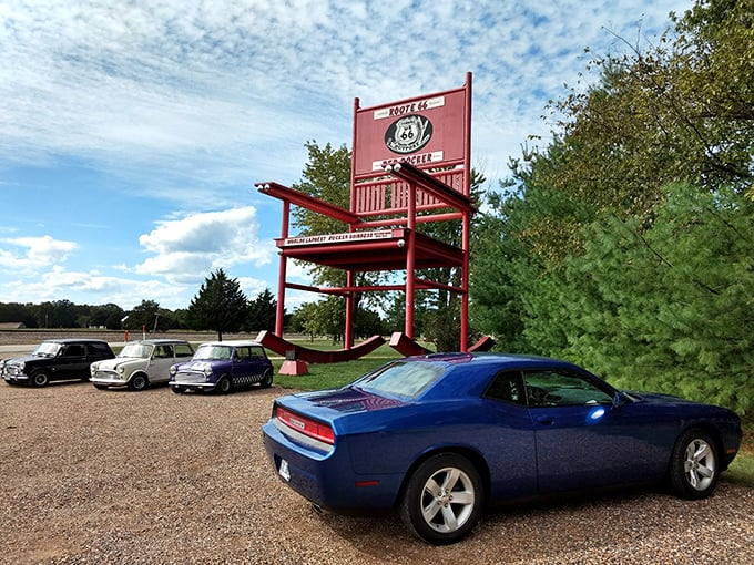Classic cars meet classic roadside kitsch. These vintage Mini Coopers could practically park on one of the chair's armrests with room to spare.