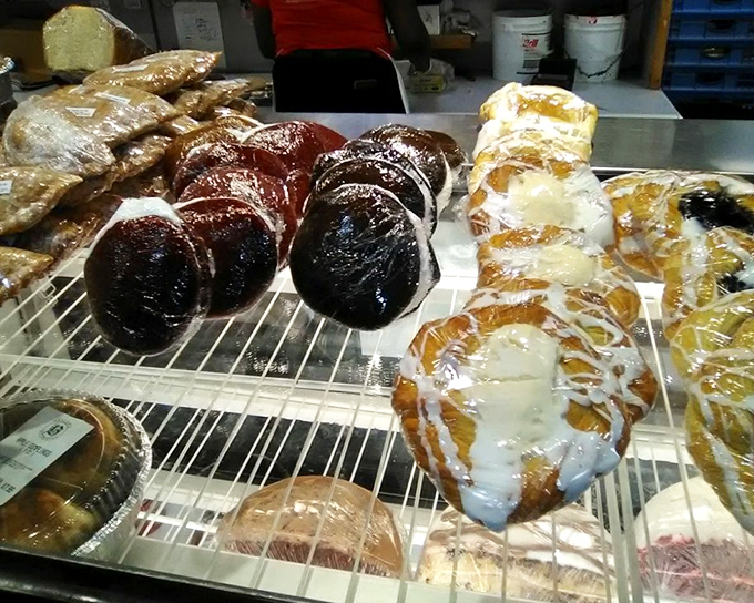 Behind the scenes at Beiler's, where skilled hands transform simple ingredients into edible art. That chocolate-covered creation is calling my name.