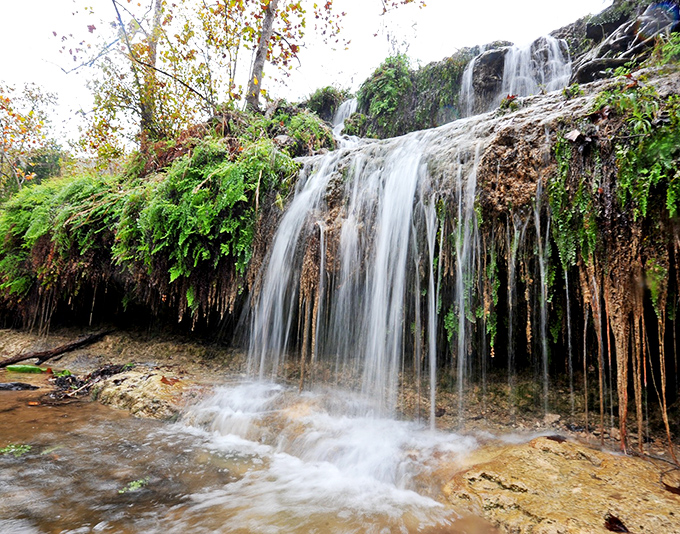 Water cascading over moss-draped limestone creates nature's own spa treatment. Exfoliation has never looked so picturesque.