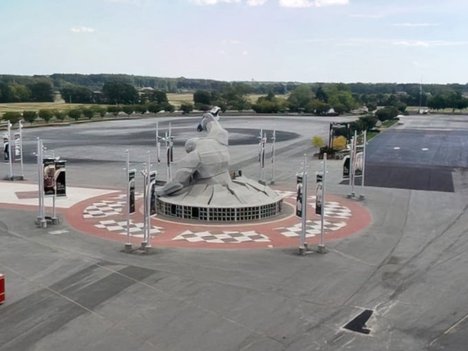 Under blue skies, Miles stands triumphant, a modern-day Colossus of Rhodes except instead of a harbor, he's guarding NASCAR's fastest concrete oval.