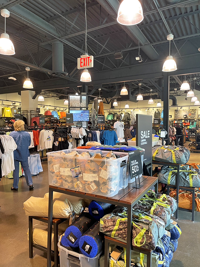 The North Face store beckons with promises of adventure gear that might actually inspire you to climb something other than stairs to the food court.