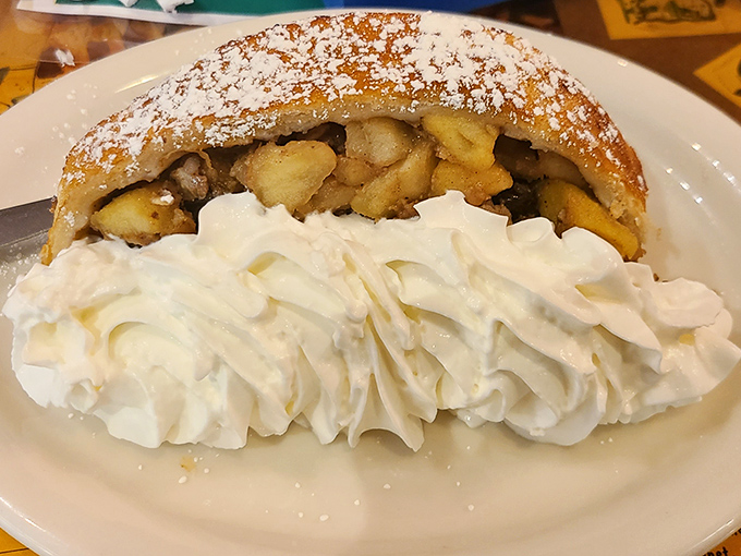 Apple strudel that whispers sweet nothings to your taste buds. That mountain of whipped cream isn't excessive&mdash;it's necessary emotional support for the experience. 