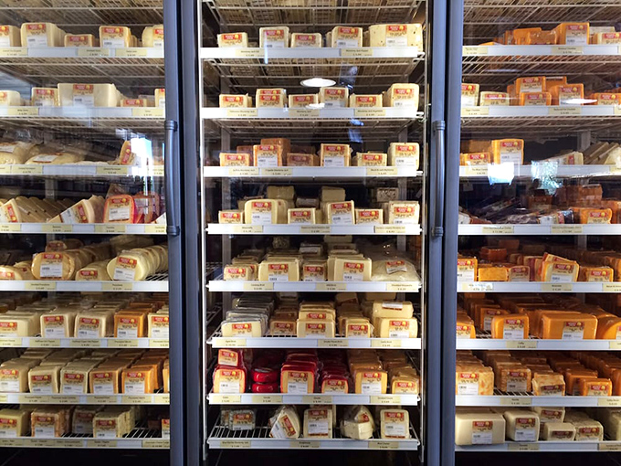Cheese heaven exists, and it's refrigerated. These meticulously arranged shelves showcase Wisconsin's dairy prowess in all its yellow and white glory. 