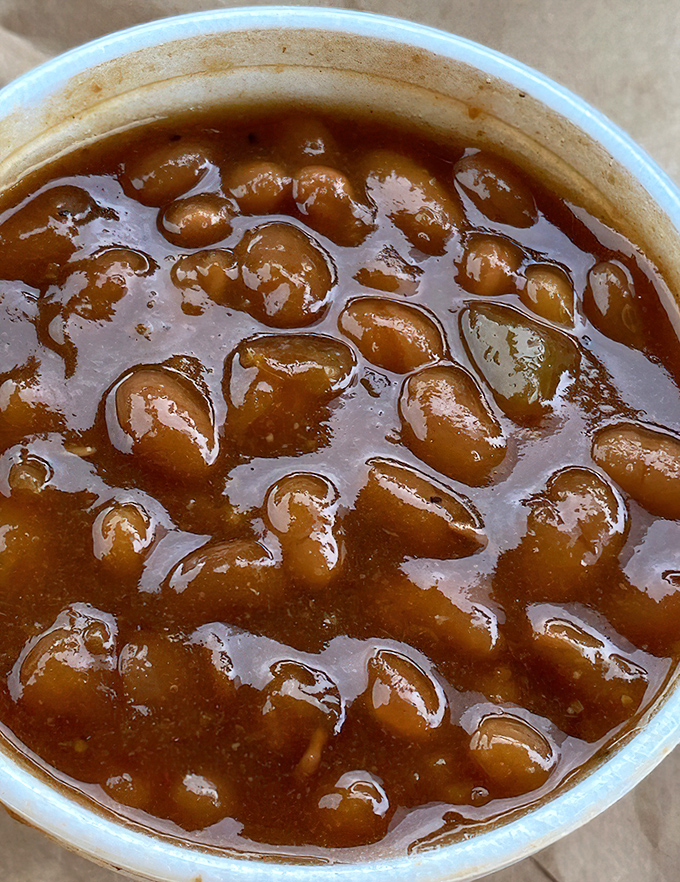 These baked beans have clearly been introduced to some smoky friends along the way. Each spoonful delivers a sweet-savory symphony.