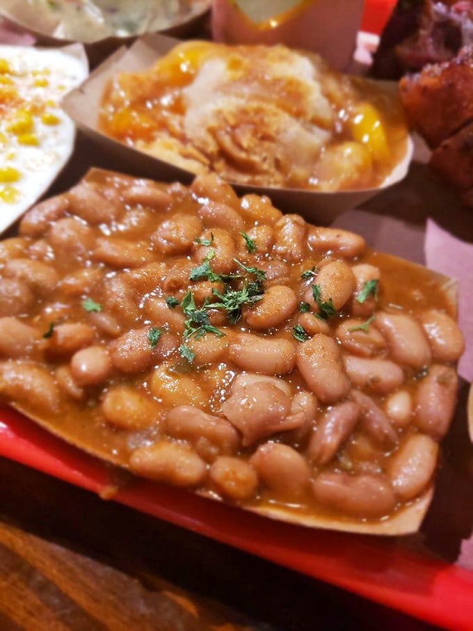 These aren't just beans; they're tiny flavor bombs swimming in liquid gold, ready to complement your meat marathon.