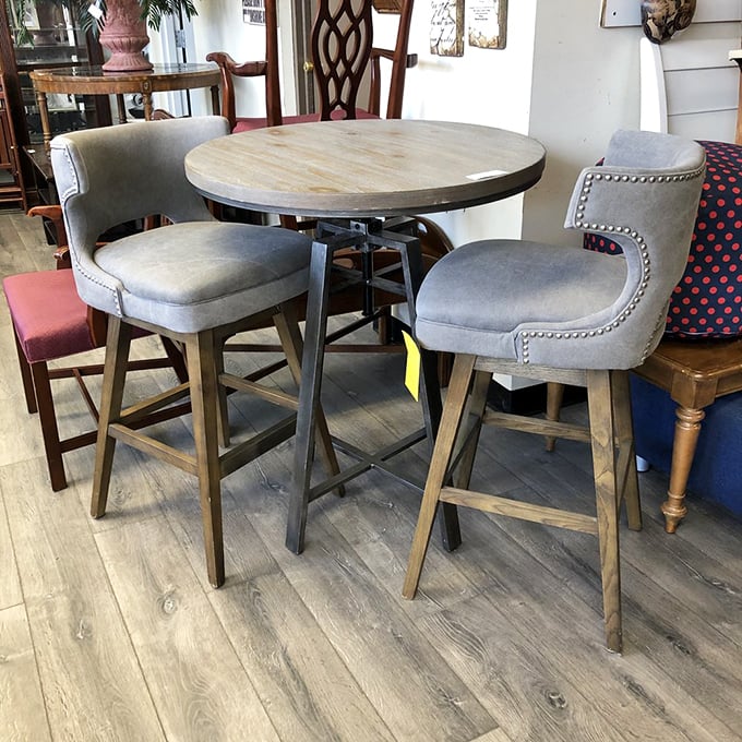 Industrial meets rustic in this bar-height dining set. The gray upholstered chairs whisper "comfort" while the metal and wood table says "I've seen things in my day."