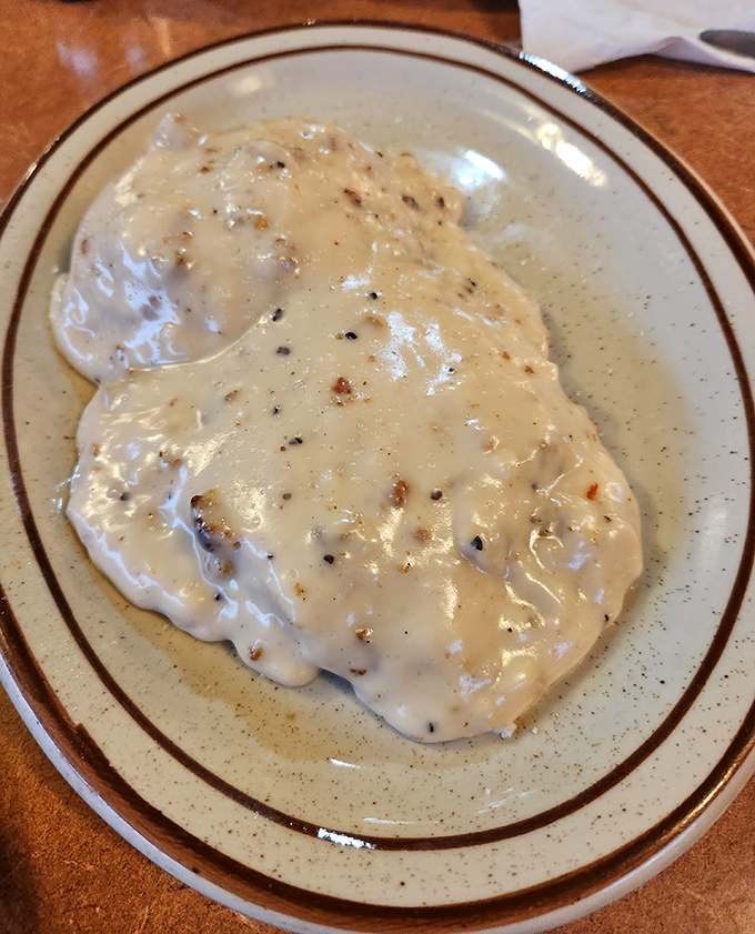 Biscuits and gravy so good you'll want to write home about it. This plate of peppery comfort could cure whatever ails you.