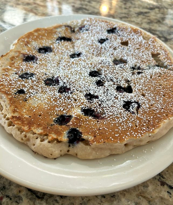 This blueberry pancake isn't just breakfast, it's edible poetry&mdash;fluffy, sweet, and dotted with fruit jewels that burst with each bite.