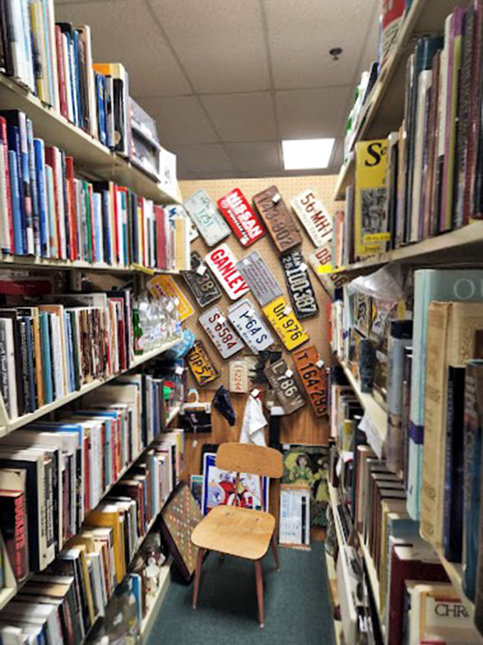 The book section&mdash;where vintage license plates mark the spot and wooden chairs invite you to sit and sample a paragraph or two.