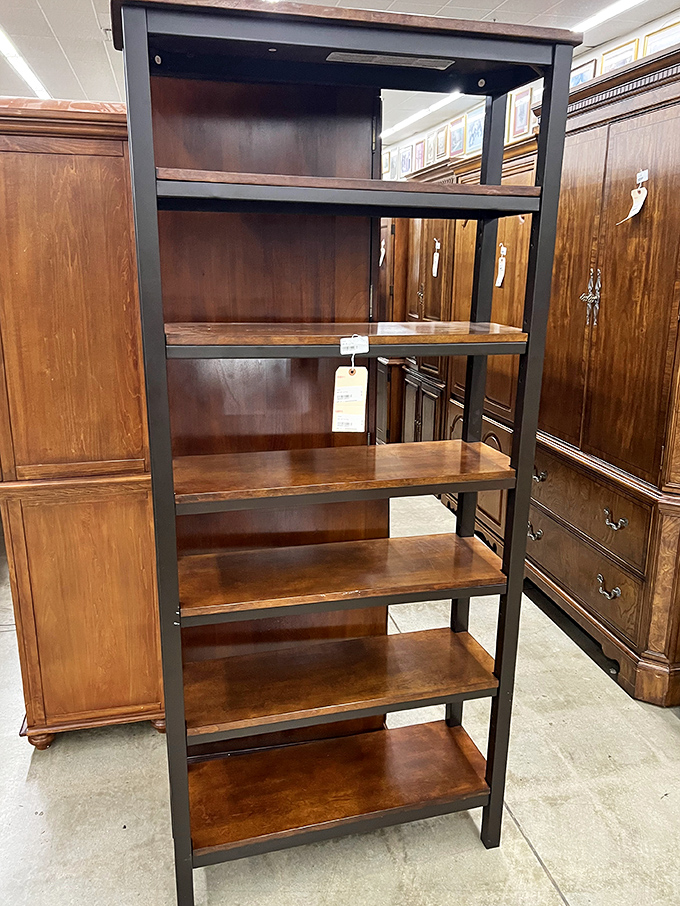 Industrial meets warmth in this bookshelf, the perfect marriage of sturdy black frame and rich wood shelves—Marie Kondo would definitely approve.