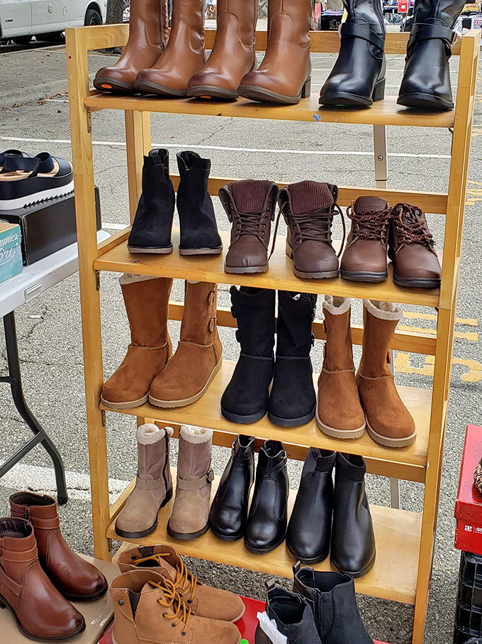 Boot boulevard! A wooden rack displays footwear ready for their second march through life, from campus strolls to weekend hikes.