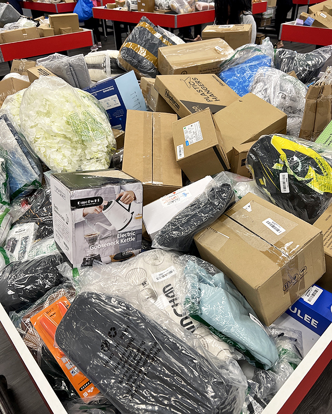 Cardboard chaos that would give professional organizers night sweats. That electric kettle peeking out might be the perfect replacement for the one that died this morning.