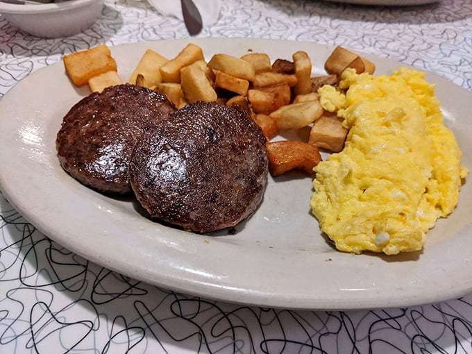 Breakfast doesn't get more serious than this&mdash;two sausage patties, golden home fries, and fluffy scrambled eggs that would make your grandmother proud.