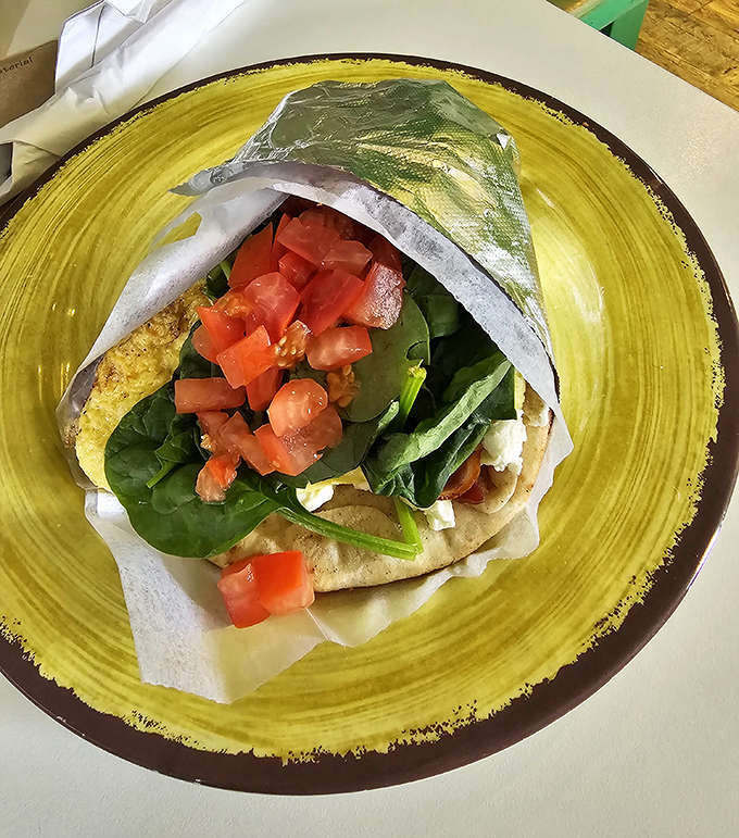 Breakfast wrapped and ready for adventure. Fresh ingredients spilling out of their tortilla home &ndash; portable perfection for beach-bound appetites.