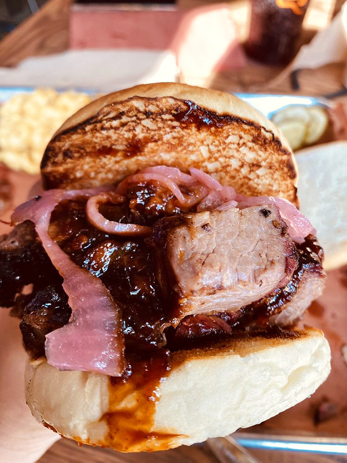 A brisket sandwich that deserves its own Instagram account. Those pickled onions cut through the richness like witty banter at a dinner party.