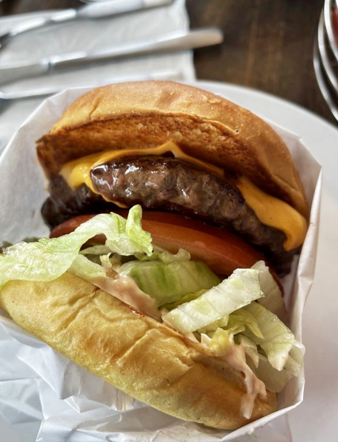 Some burgers wear their simplicity like a badge of honor. This one isn't trying to impress you with fancy toppings&mdash;it knows its perfectly charred patty speaks for itself.