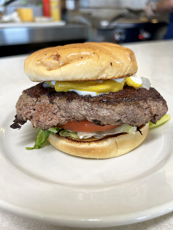 The burger arrives like a heavyweight champion entering the ring&mdash;substantial, confident, and ready to knock out your hunger with a single, juicy round. 