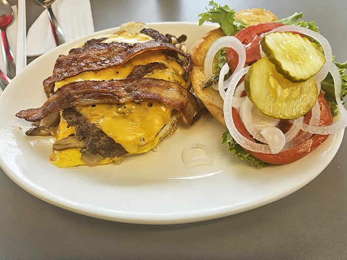 The cheeseburger that launched a thousand napkins&mdash;gloriously messy and unapologetically delicious with all the proper fixings.