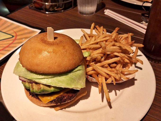 Not just another burger—this is architecture you can eat, with each layer thoughtfully constructed for maximum flavor impact.