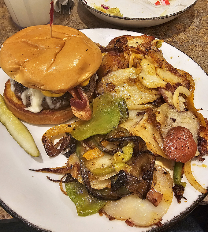 That burger looks like it graduated from the "How to Make People Happy" school of cooking, with a side of home fries that didn't skip a single class.