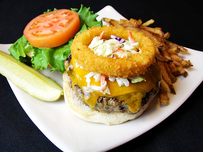 A burger that demands to be photographed before eaten&mdash;melted cheese cascading over a perfectly grilled patty with crispy fries standing at attention.