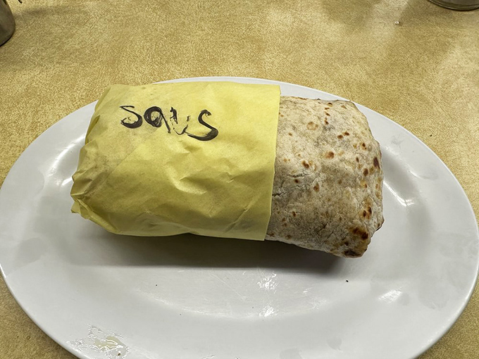 The breakfast burrito—California's greatest contribution to morning cuisine since orange juice. Wrapped with care and labeled with love, it's portable perfection.