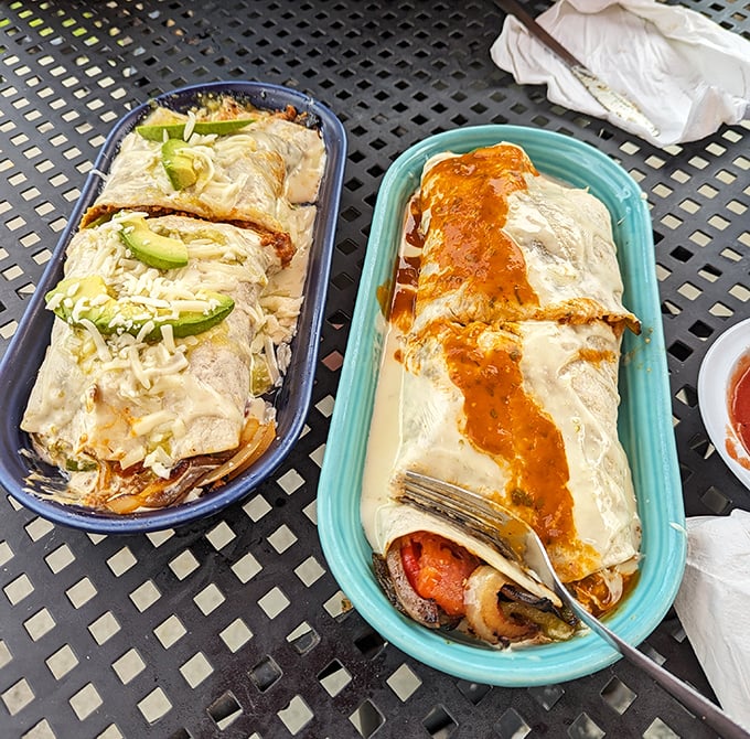 The burritos that launched a thousand road trips! These tortilla-wrapped treasures come smothered in sauce and topped with fresh avocado slices.