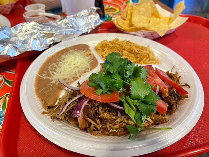 Carnitas so tender they practically fall apart before your fork even thinks about touching them.