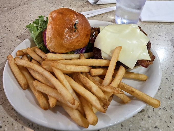 This isn't just a cheeseburger&mdash;it's a hand-held masterpiece of beef, cheese, and possibility, escorted by golden fries.