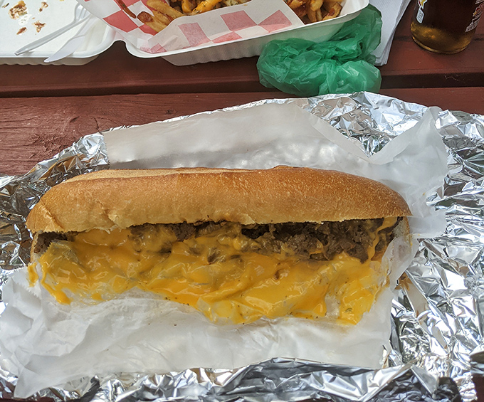 Yellow cheese cascading over seasoned beef like Niagara Falls, if the falls were made of deliciousness. This cheesesteak doesn't just satisfy hunger&mdash;it conquers it.