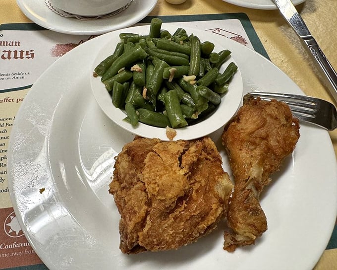 Fried chicken so perfectly golden it deserves its own trophy, paired with green beans that actually remember what sunlight feels like.