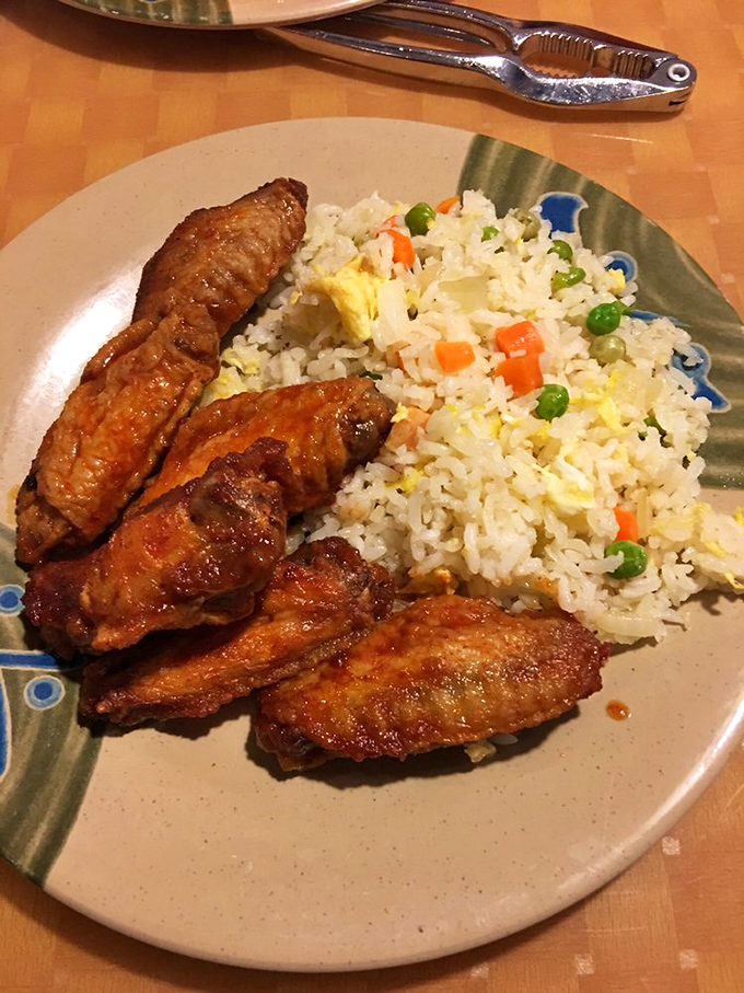 Crispy wings and perfectly cooked fried rice&mdash;the dynamic duo that makes you wonder why you ever bothered with delivery.